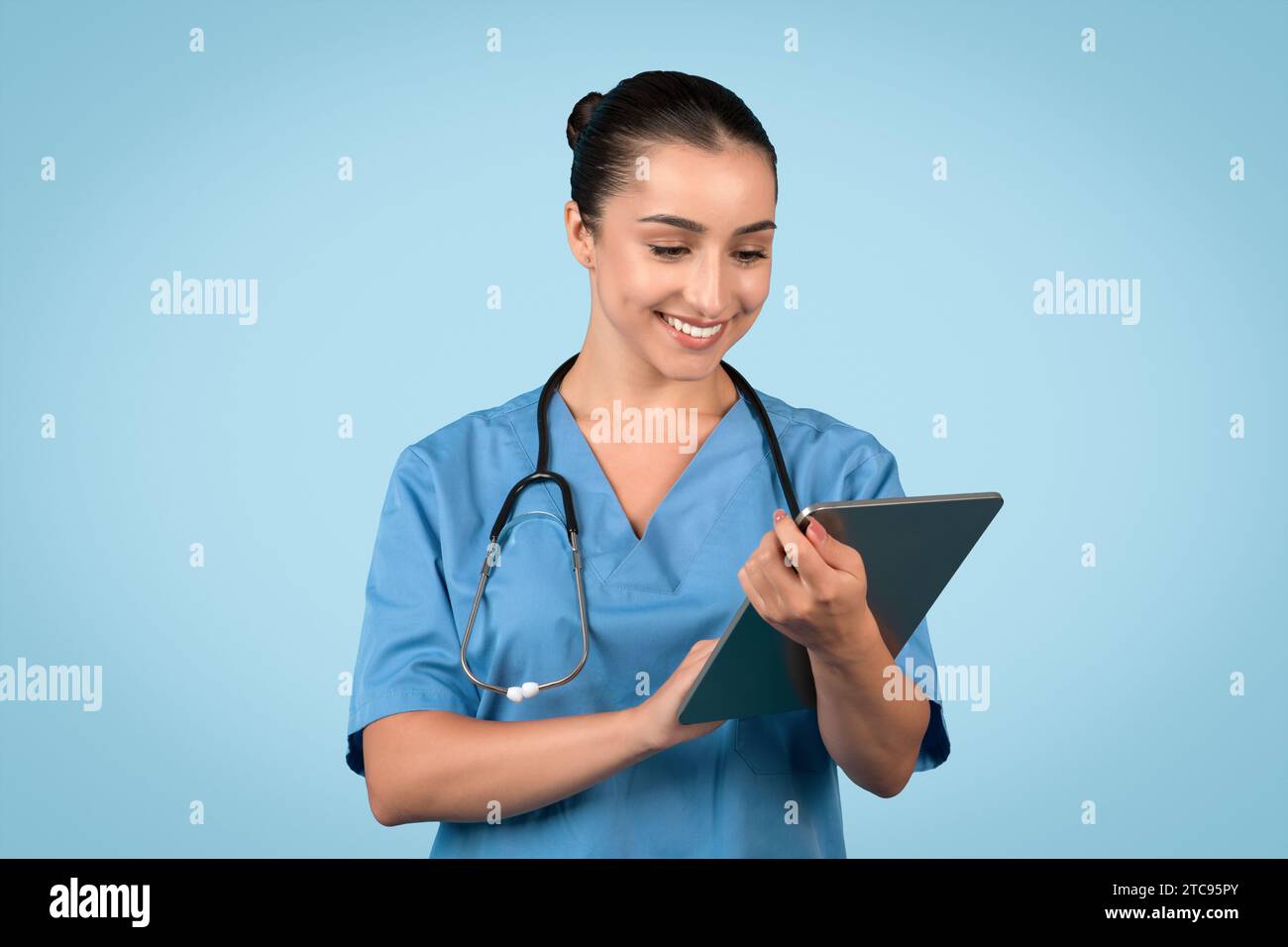 Smiling female nurse reviewing hi-res stock photography and images - Alamy