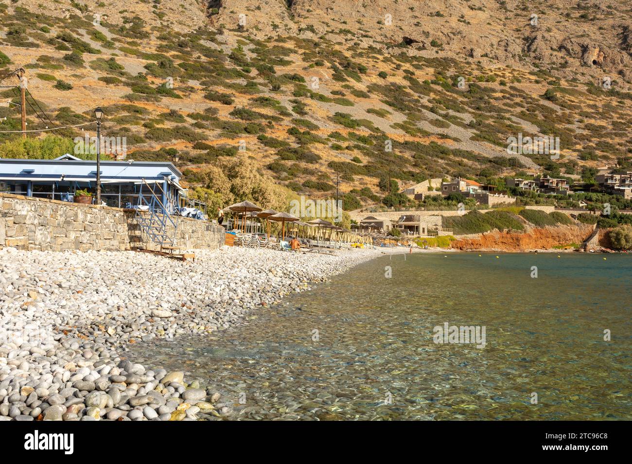 Pebble beach in the coastal village of Plaka, Crete, Greece Stock Photo ...