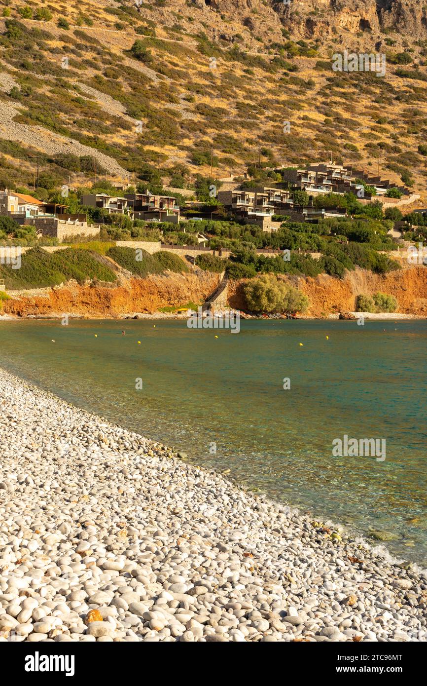 Pebble beach in the coastal village of Plaka, Crete, Greece Stock Photo ...