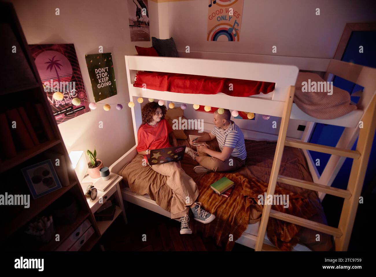 High angle view at two young students doing homework together sitting ...