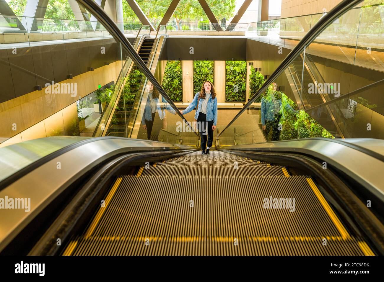 Teenage Girl Riding an Escalator in Downtown San Francisco Modern ...