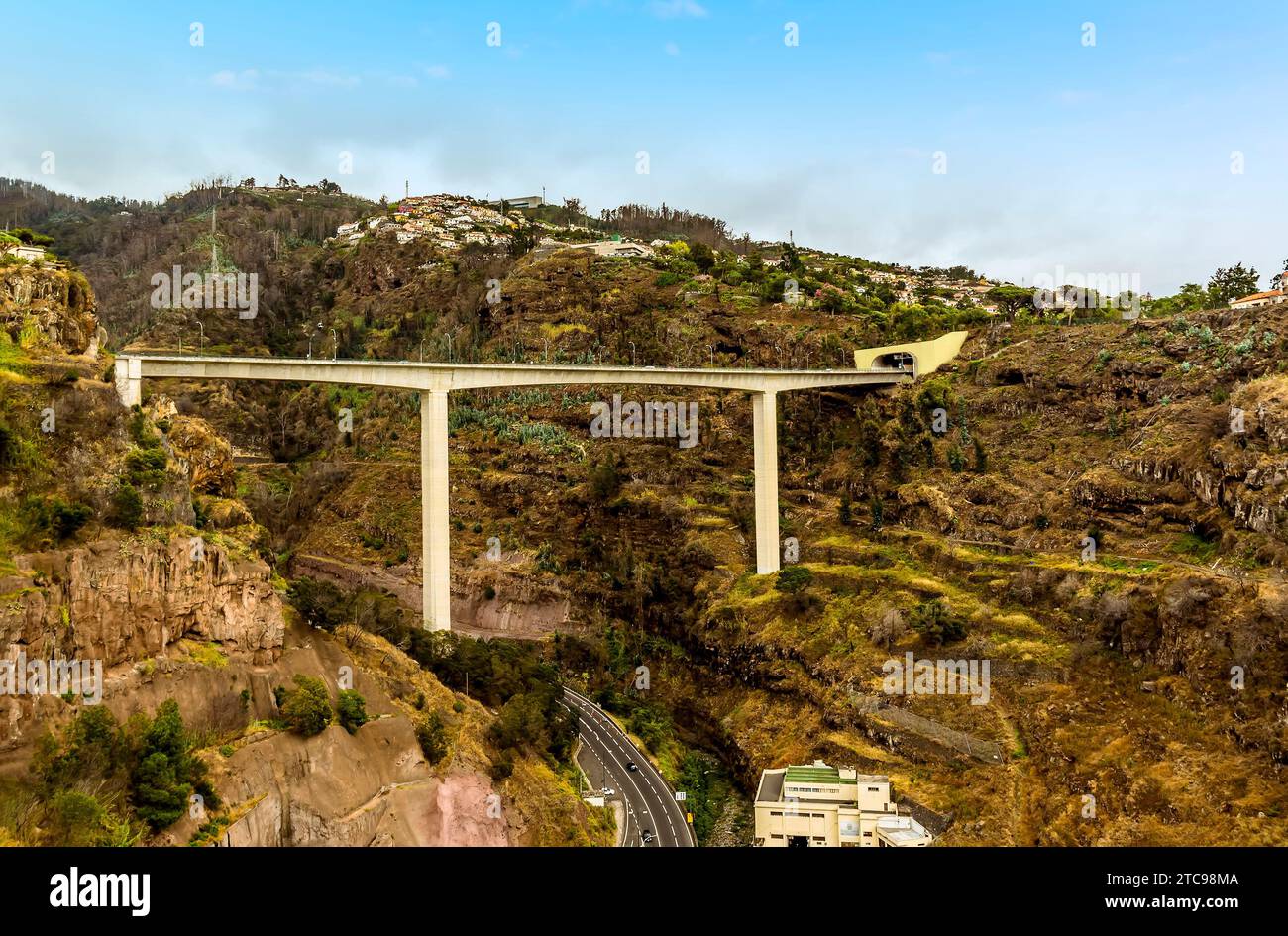 A view from the chair lift up towards the roads above the city of ...
