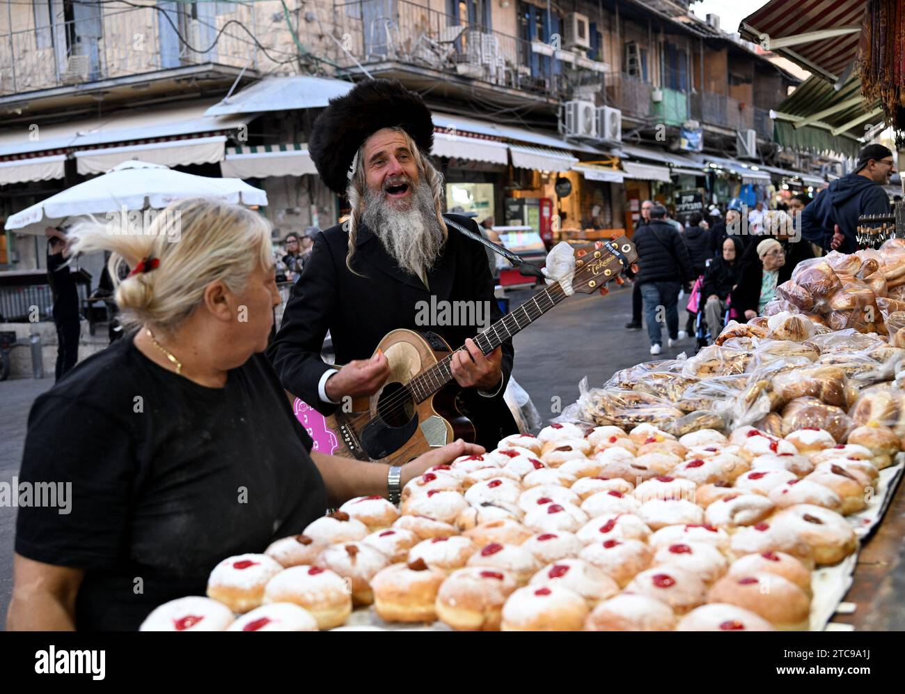 Jerusalem, Israel. 11th Dec, 2023. An Ultra-Orthodox Jew plays a guitar ...