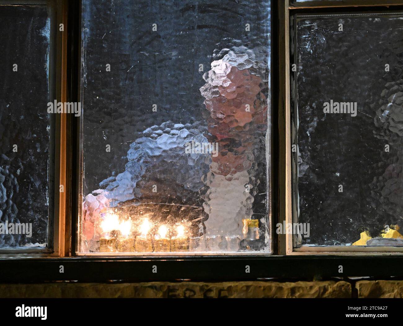 Jerusalem, Israel. 11th Dec, 2023. An Ultra-Orthodox Jew lights a ...