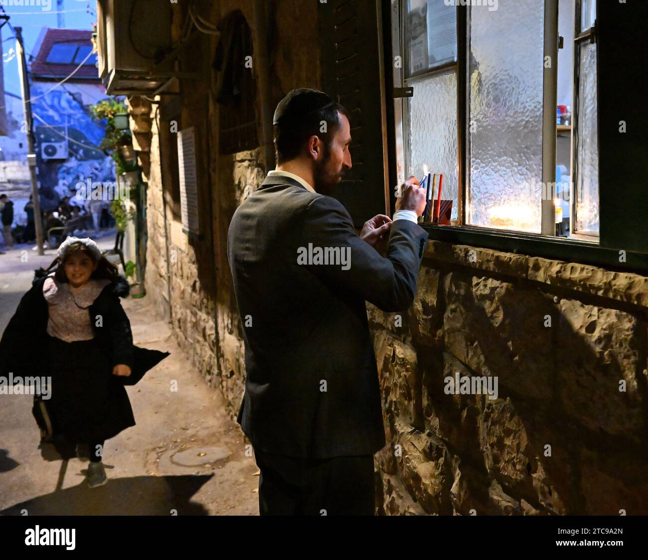 Jerusalem, Israel. 11th Dec, 2023. An Ultra-Orthodox Jew lights a ...
