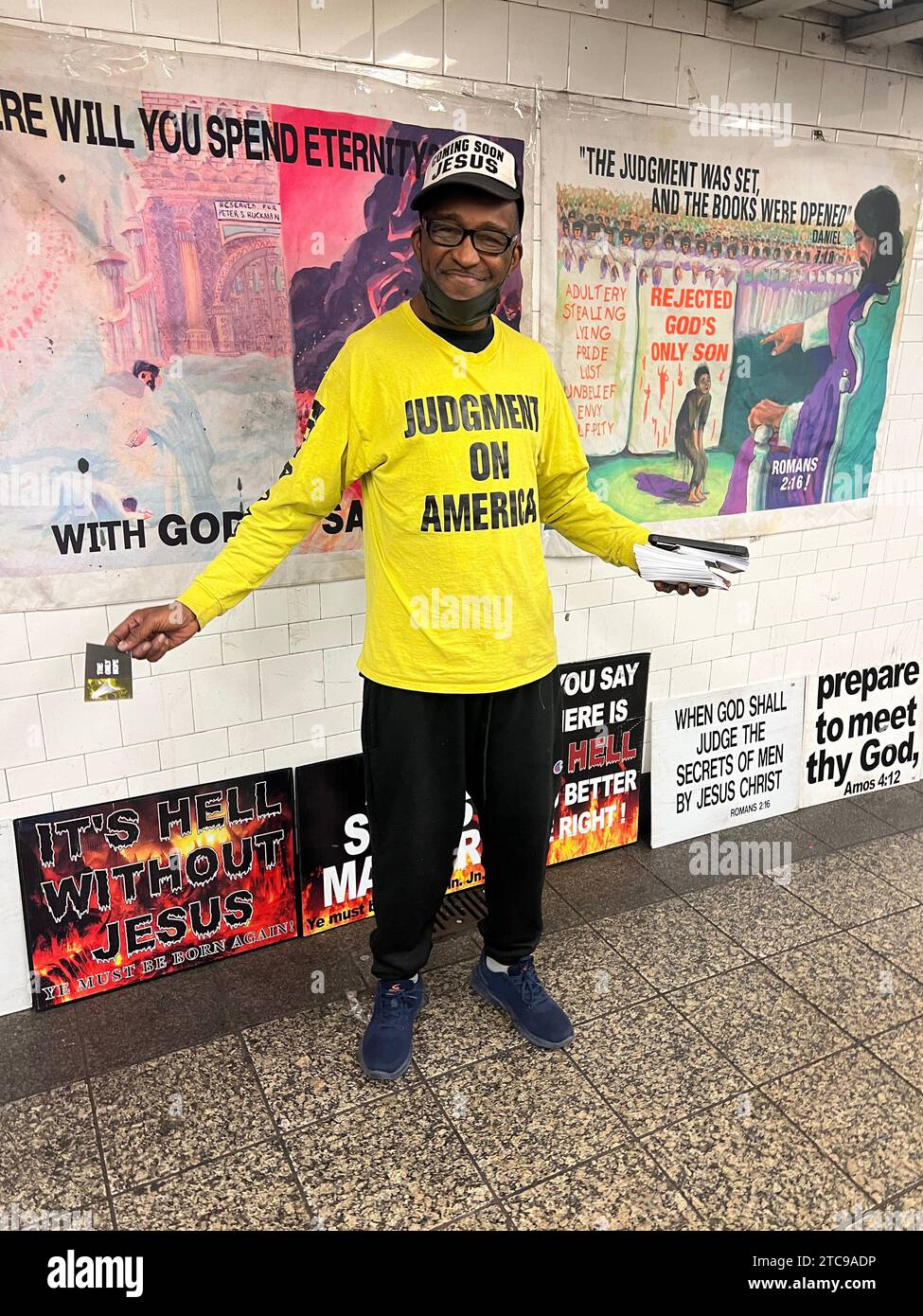 Christian Street preacher works a New York City subway station praising ...