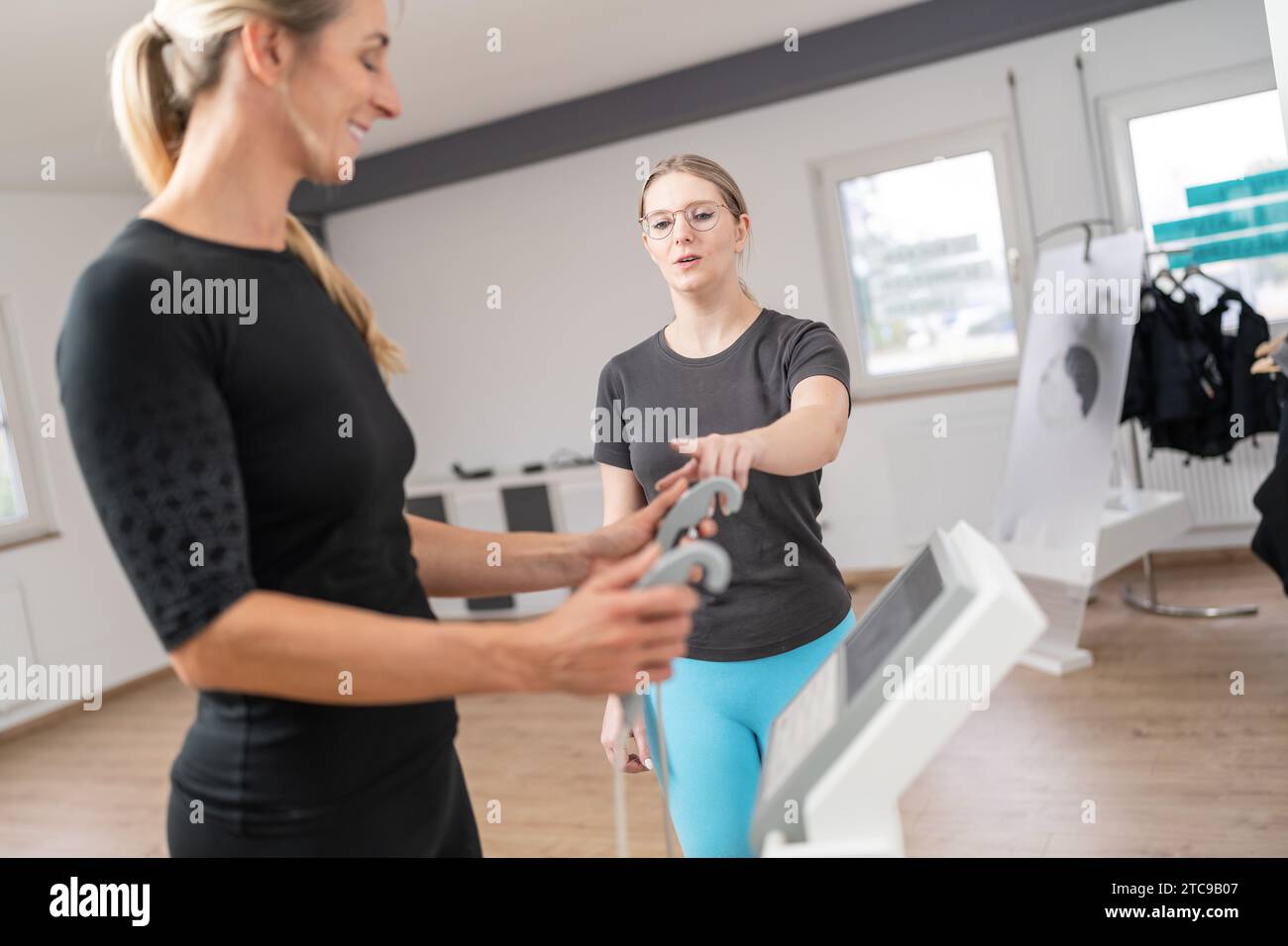 Trainer explaining body composition scale for Inbody analysis test ...