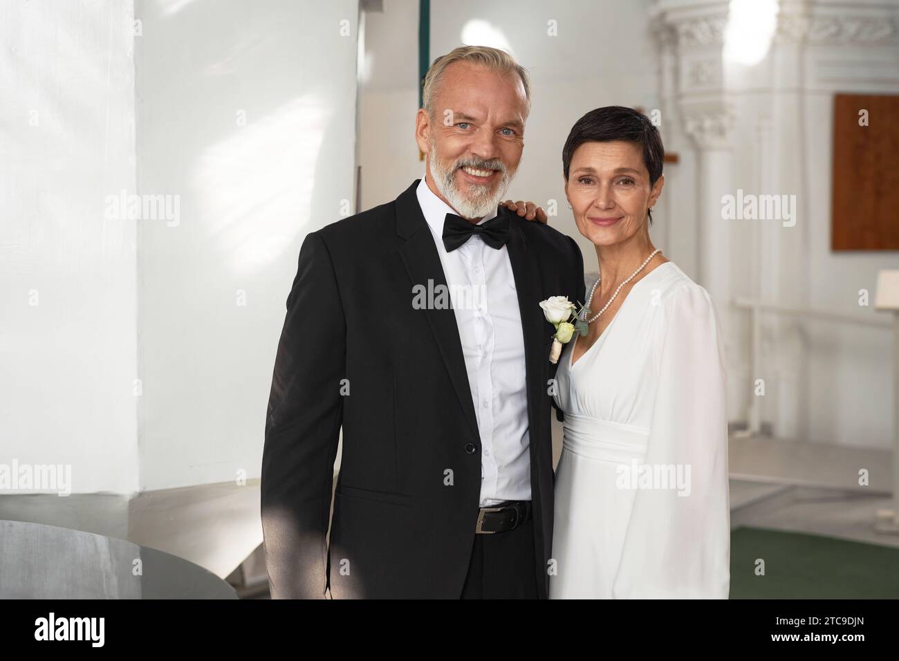 Wait up portrait of elegant senior couple as bride and groom posing ...