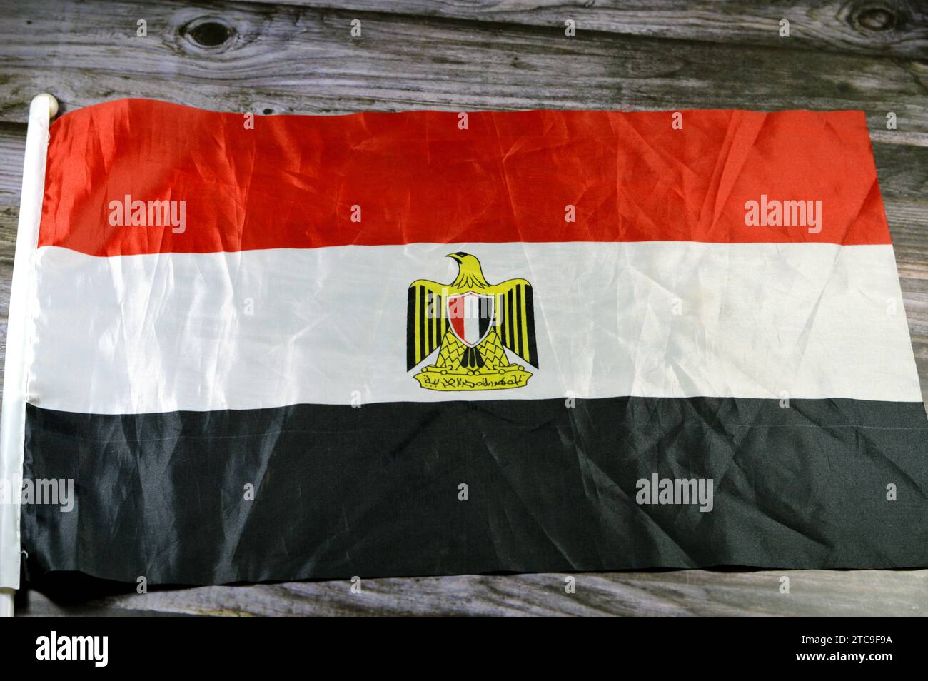 The national flag of Egypt, a tricolour consisting of the three equal ...