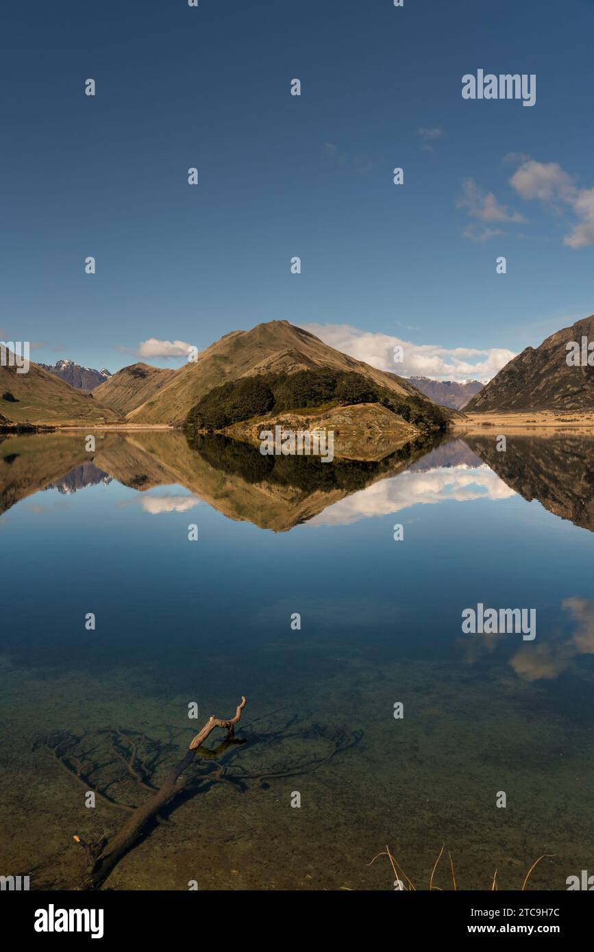 Crystal clear reflection on the very still water moke lake in the ...