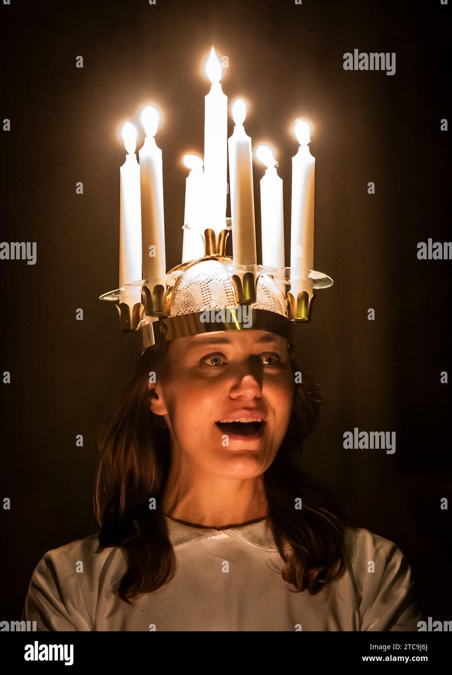 Linnea Isén wears a crown of candles symbolising St Lucy as she leads ...