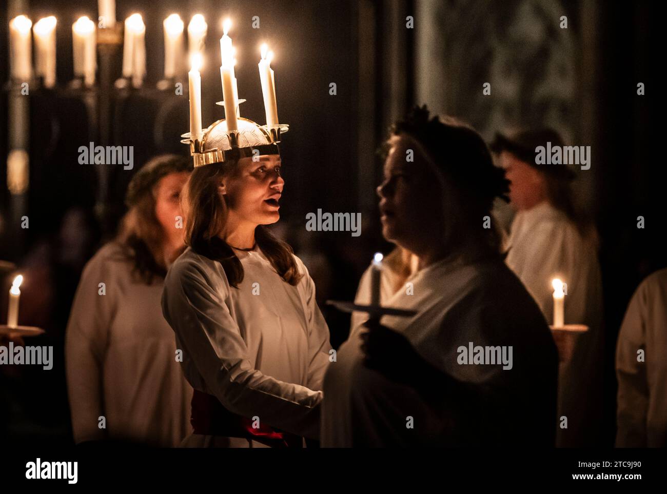 Linnea Isén wears a crown of candles symbolising St Lucy as she leads ...