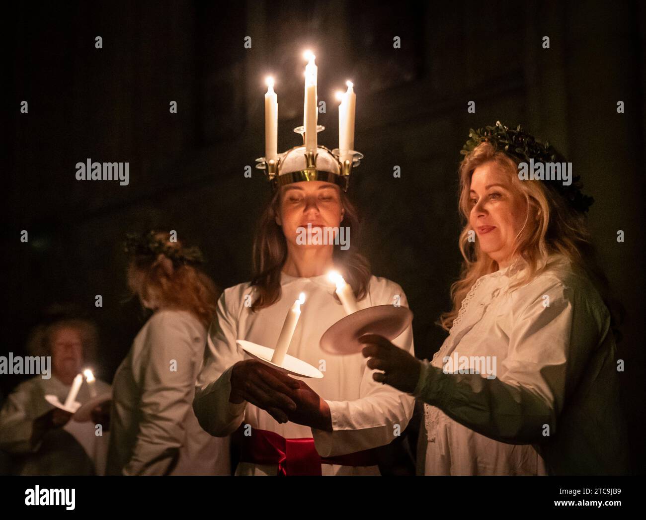 Linnea Isén wears a crown of candles symbolising St Lucy as she leads ...