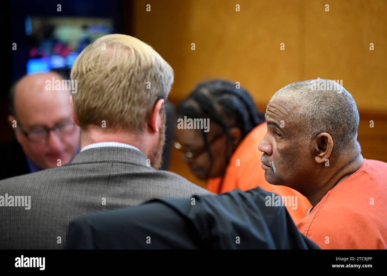 Jesse Franks, right, and Felicia Adams, center, talk to defense ...