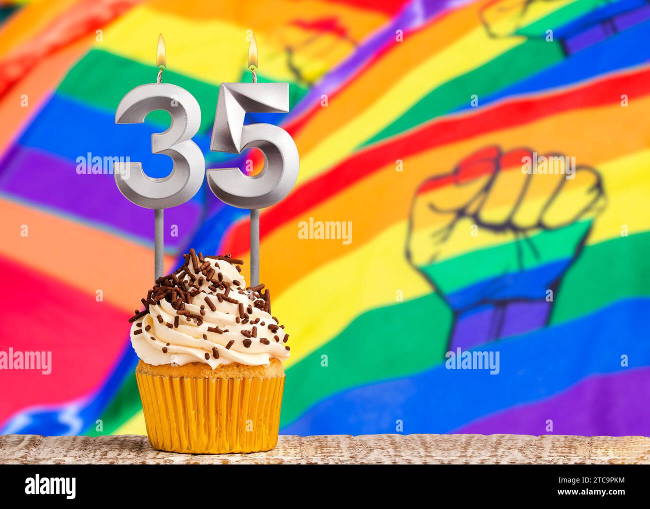 Birthday candle number 35 - Gay march flag background Stock Photo - Alamy