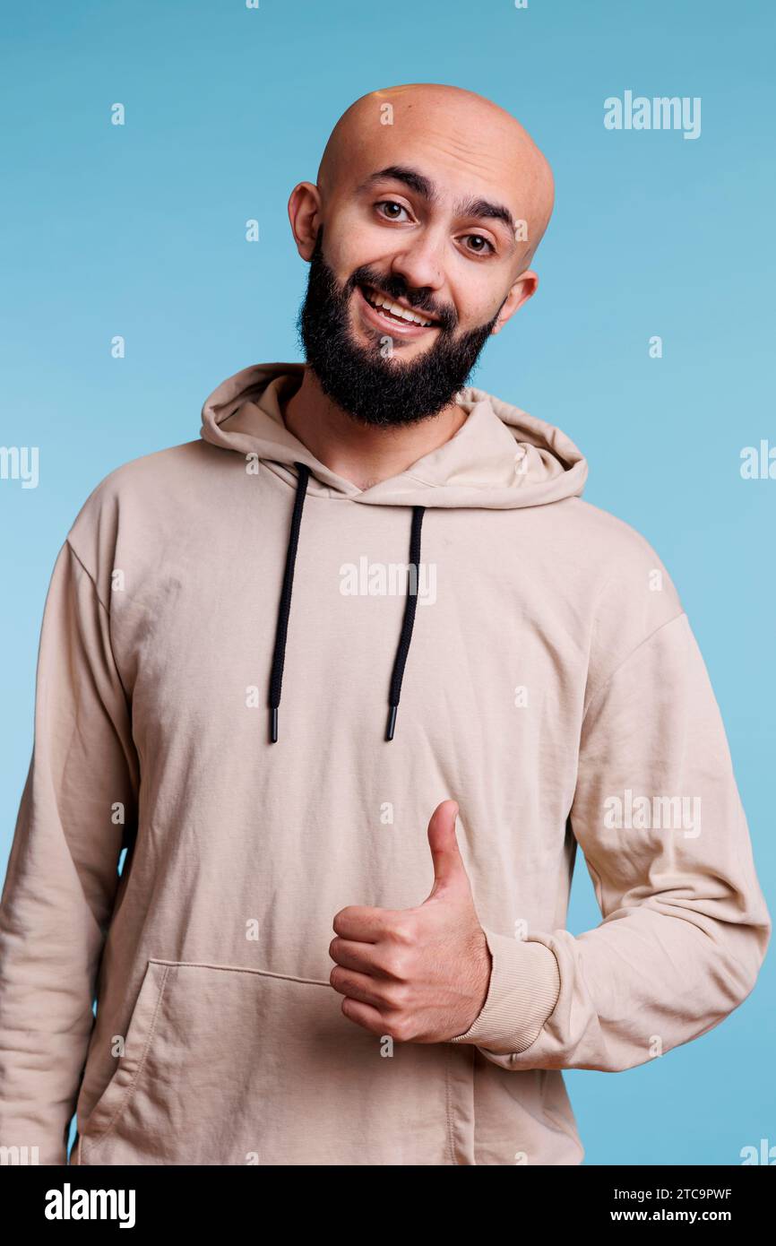 Happy arab man with thumb up signal showing satisfaction portrait ...