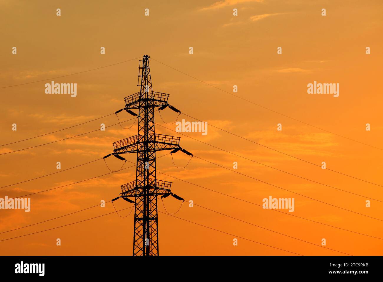 High voltage electricity line in Ukraine On Sunset. Concept of Russian ...