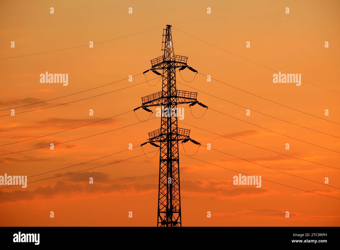 High voltage electricity line in Ukraine On Sunset. Concept of Russian ...