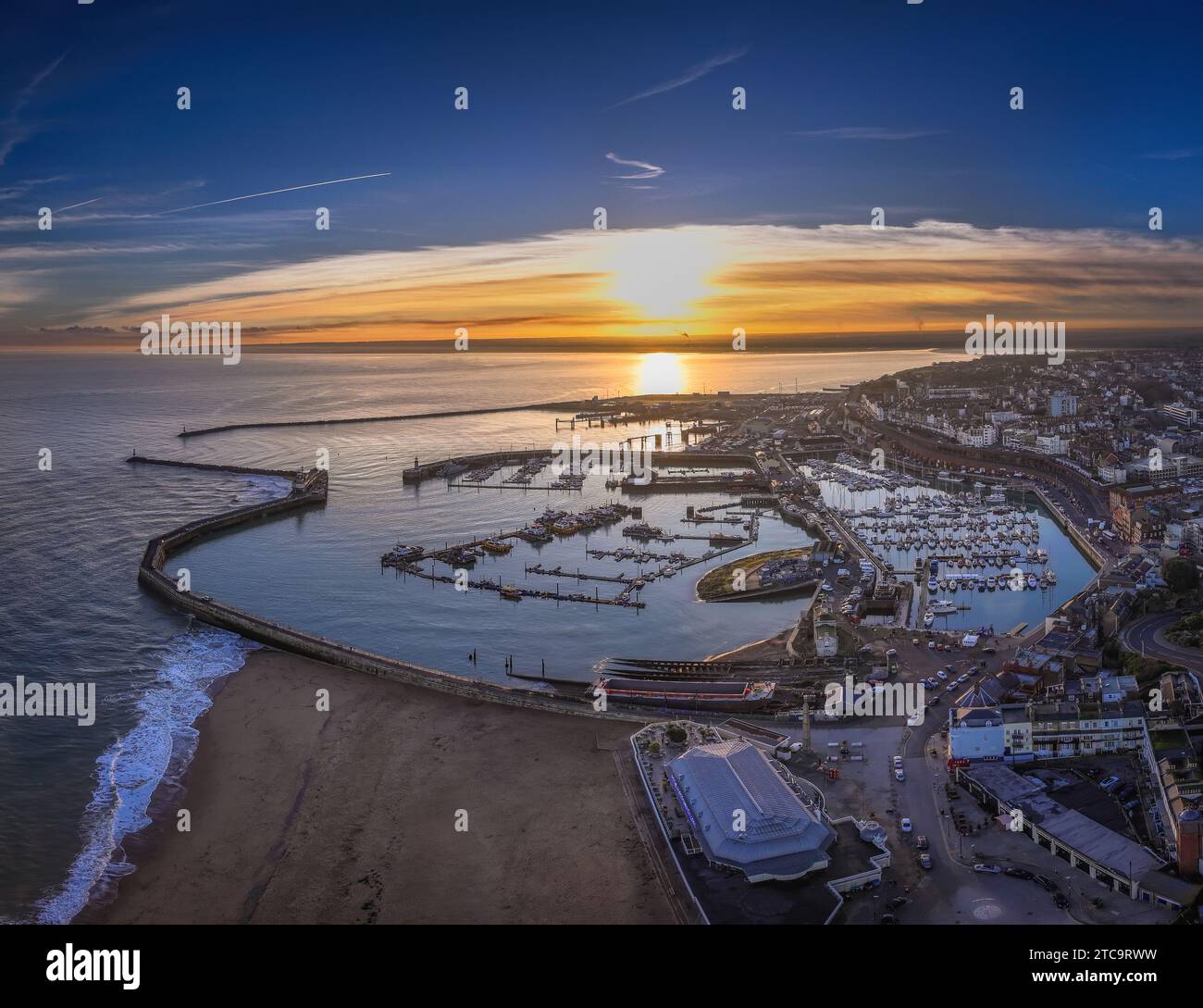 A stunning scenic view of a picturesque seaside town as the sun rises ...
