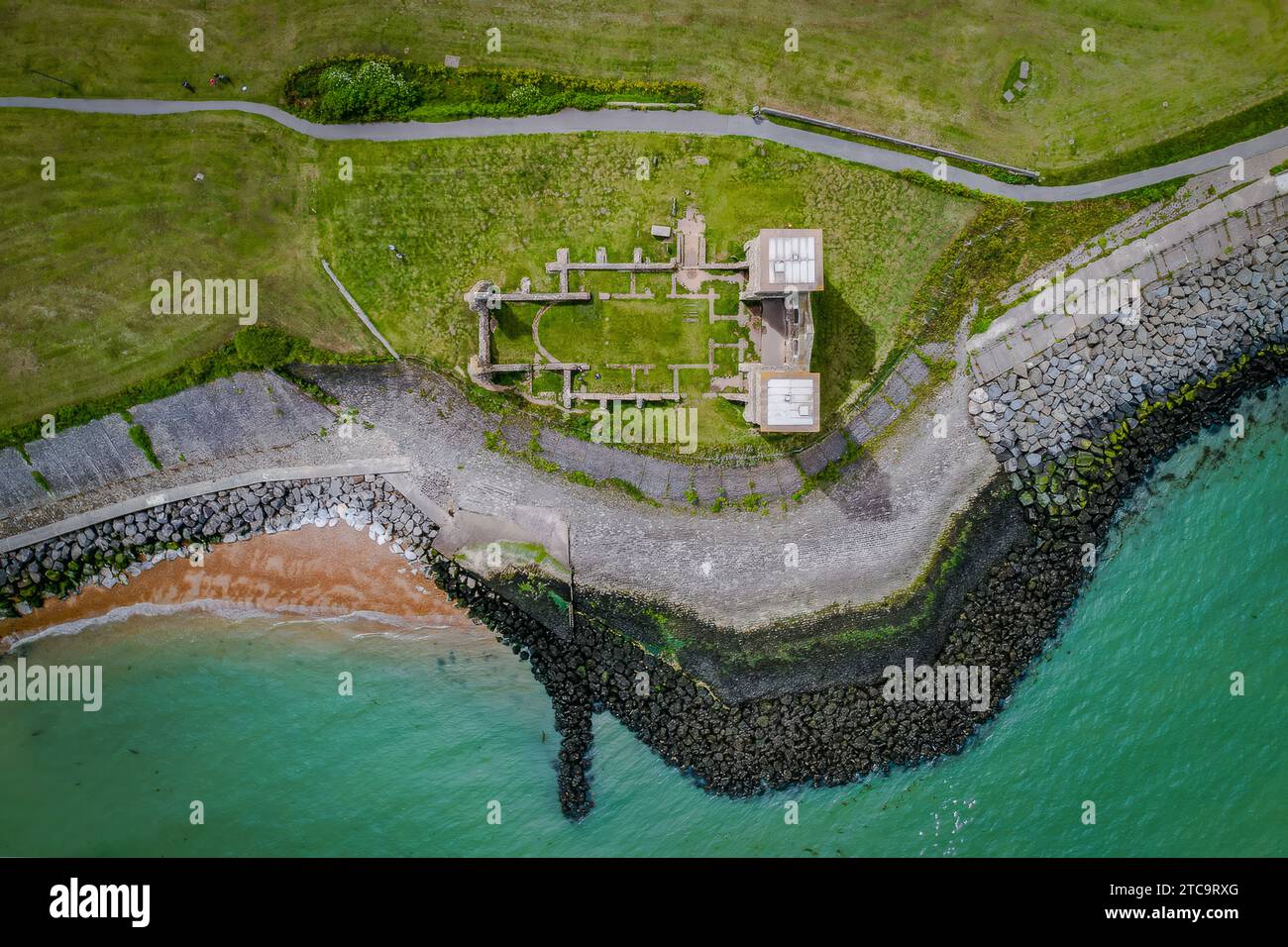 An aerial view of a quaint beachside home situated on the waterfront ...