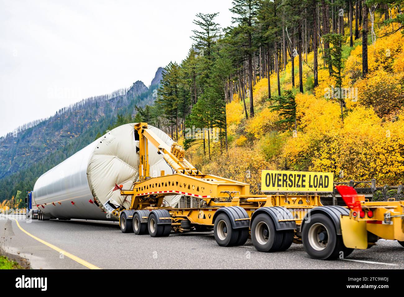 Big rig semi truck transporting oversized part of the wind generator ...