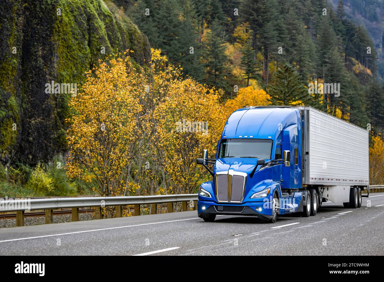 Classic carrier big rig blue semi truck with extended cab for truck ...