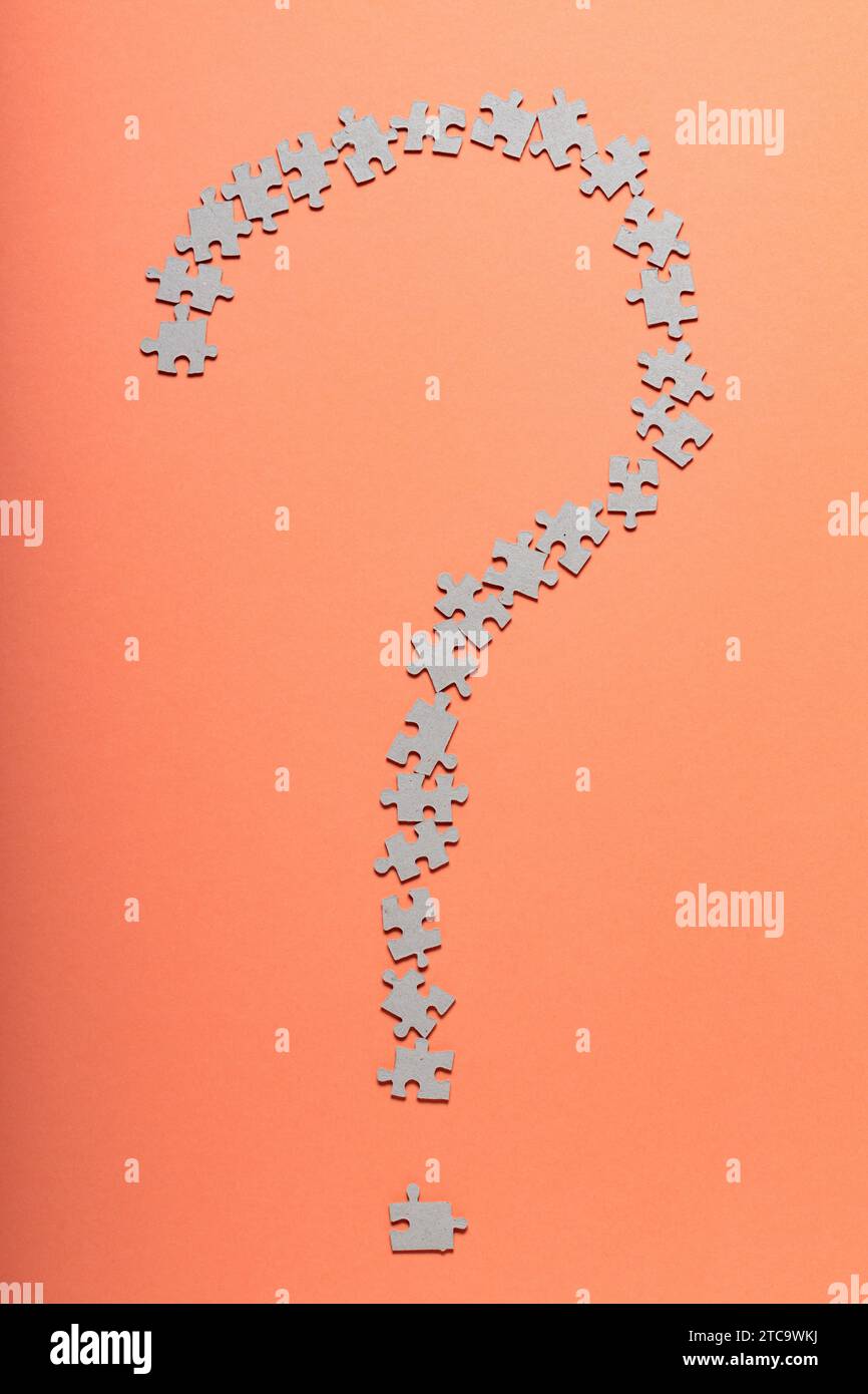 Question Mark Made of Puzzle Pieces on an Orange Background, Concept of ...