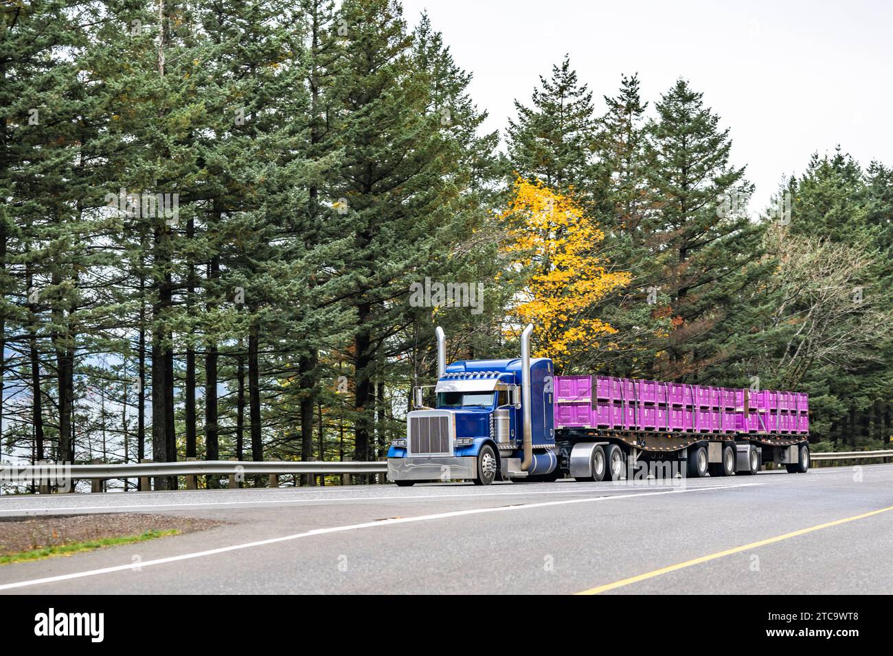 Classic long hauler carrier big rig blue semi truck tractor with ...