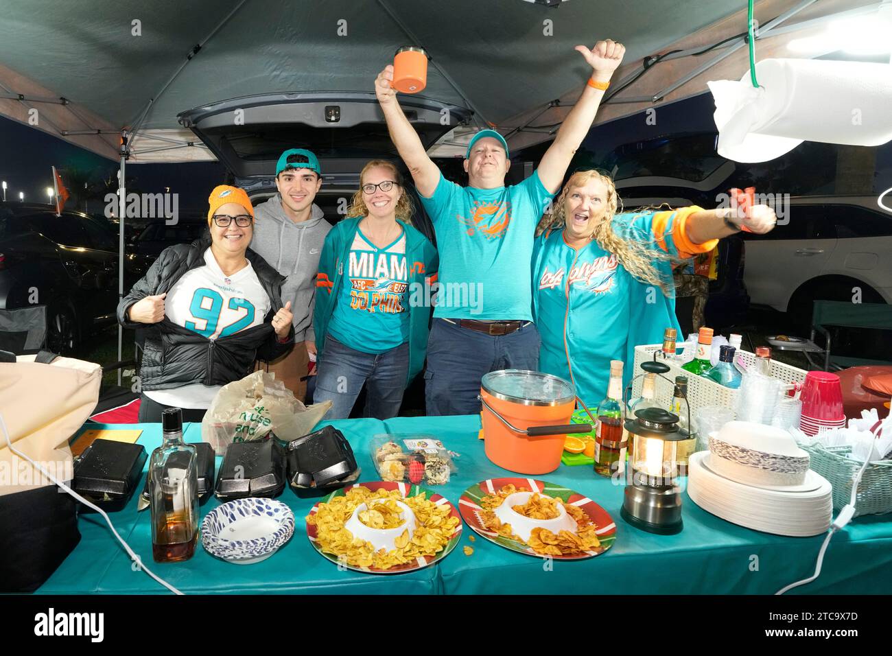 Dolphins fans tailgate in the parking lot of Hard Rock Stadium before ...
