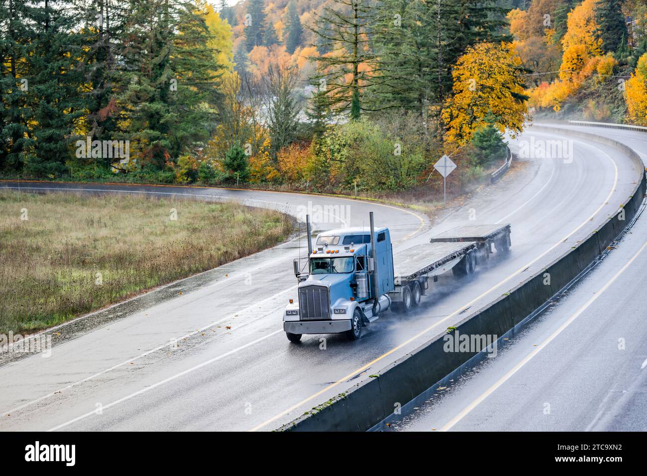 Classic long hauler carrier big rig blue semi truck tractor with ...