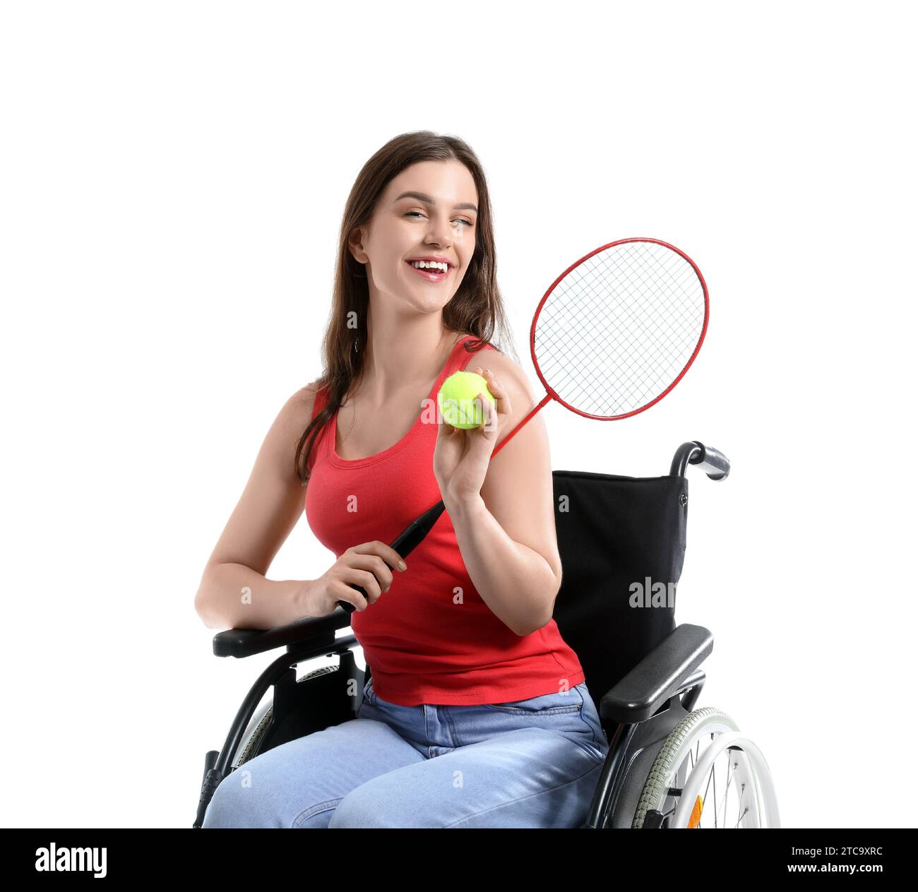 Young woman in wheelchair with tennis racket and ball on white ...