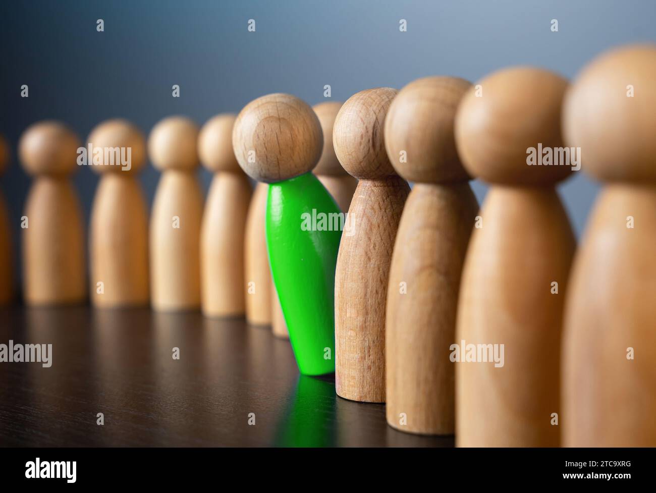 The green man looks out from the queue. Stand out from the gray mass ...