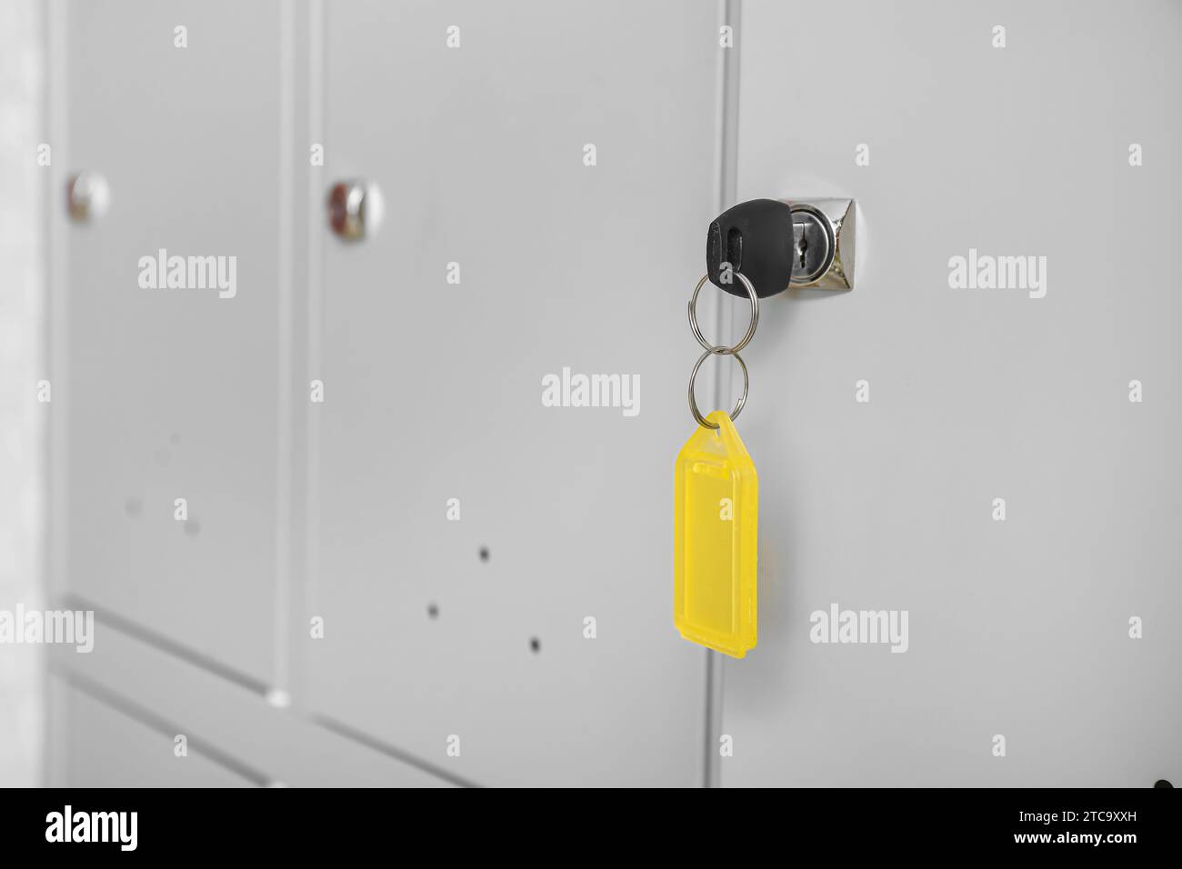 Modern locker with key, closeup Stock Photo - Alamy