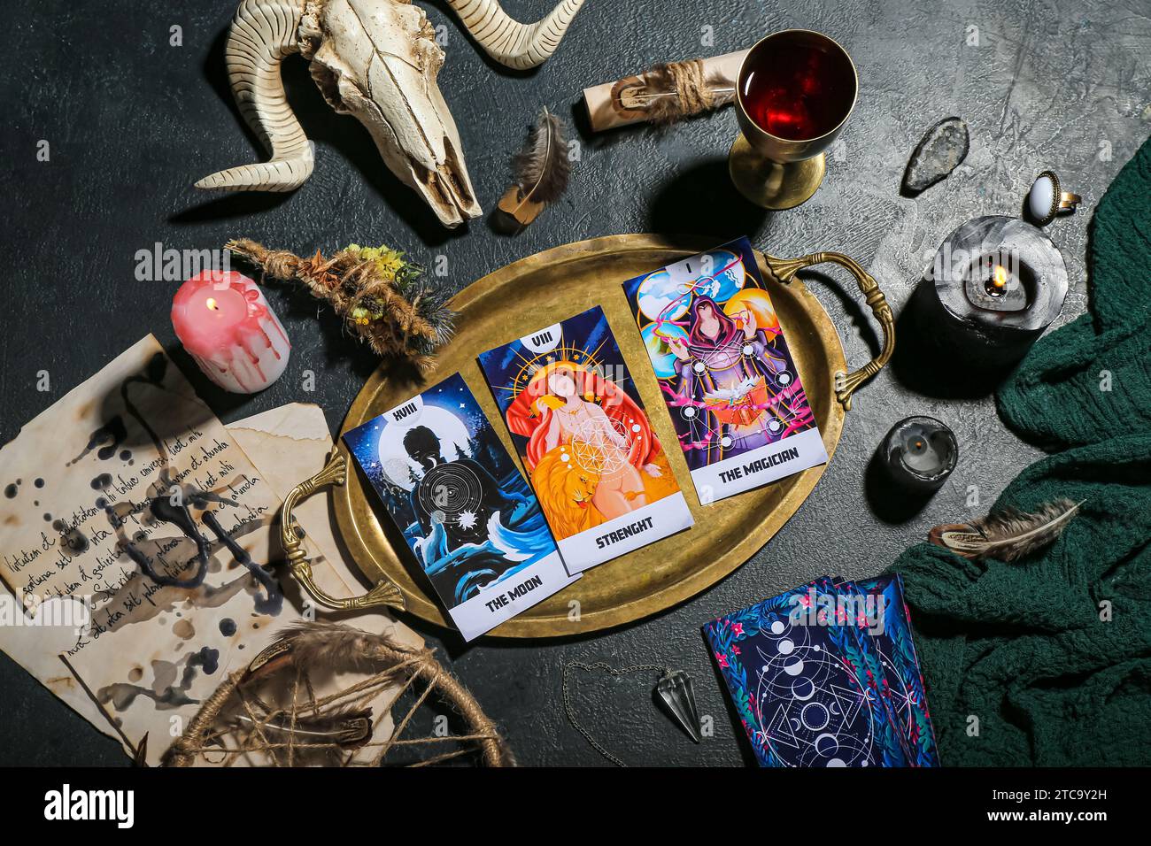 Witch's magic attributes with tarot cards, skull of sheep and burning ...