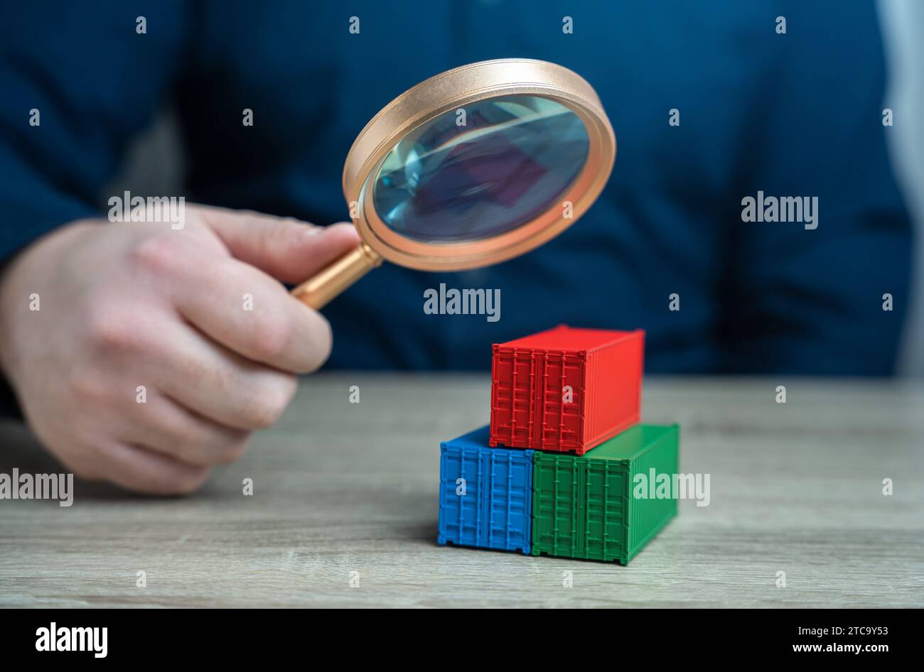 Examining cargo containers through a magnifying glass. Studying the ...