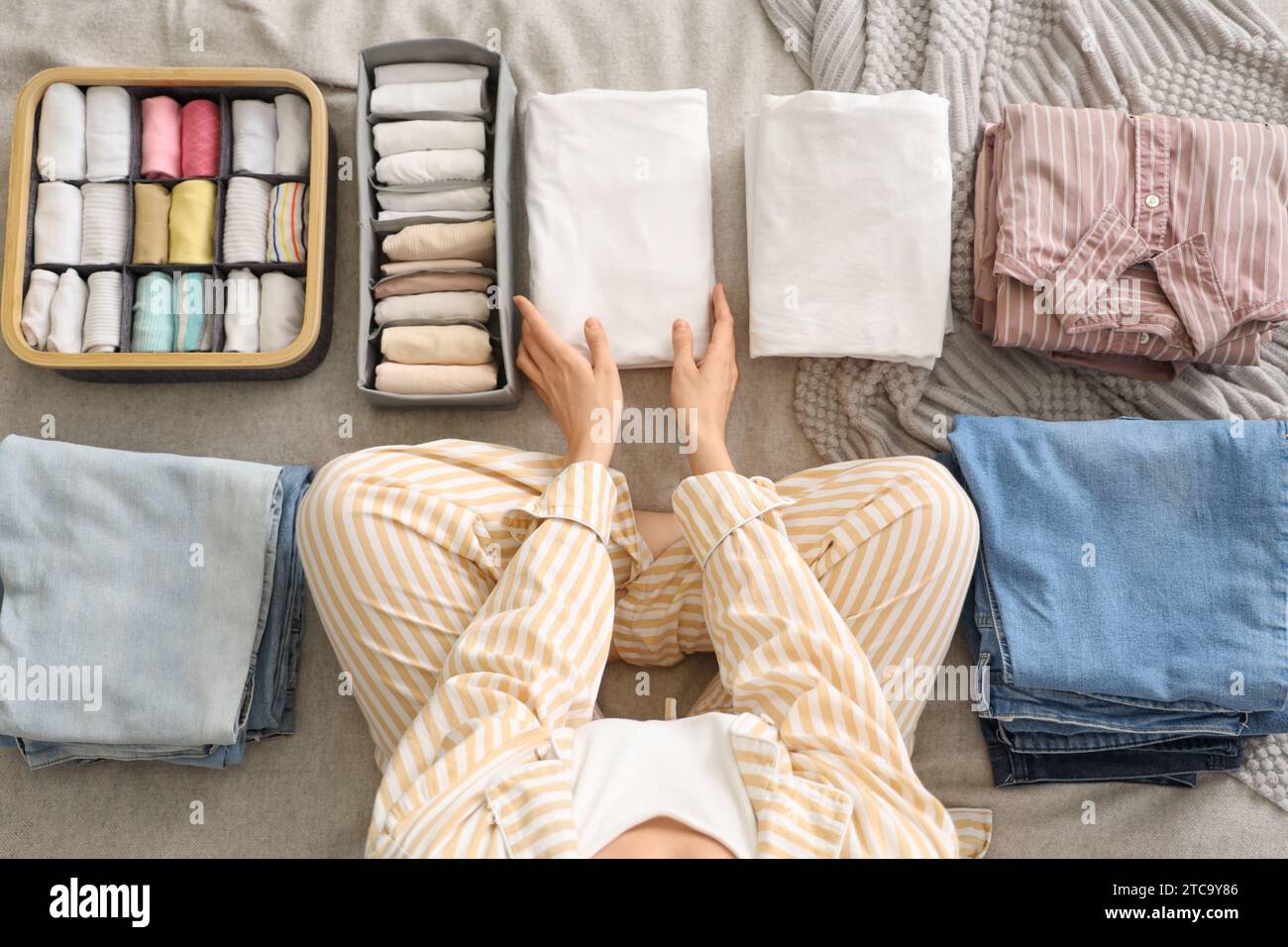 Sorting clothes on bed hi-res stock photography and images - Alamy