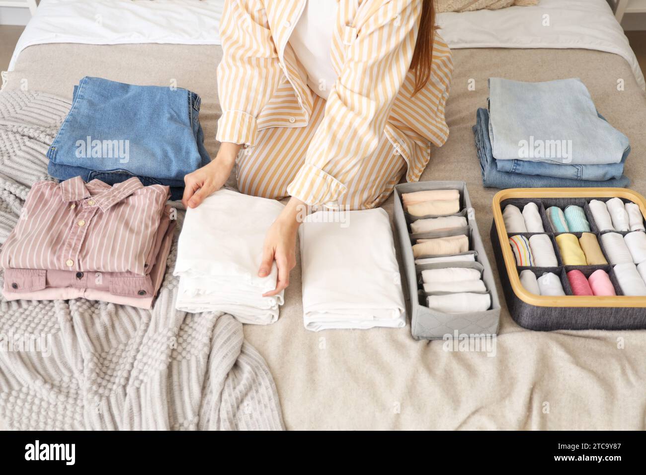 Sorting clothes on bed hi-res stock photography and images - Alamy