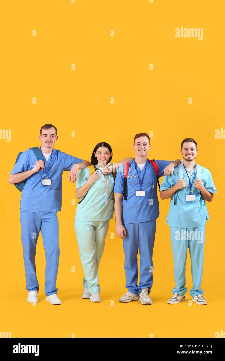 Group of medical students on yellow background Stock Photo - Alamy
