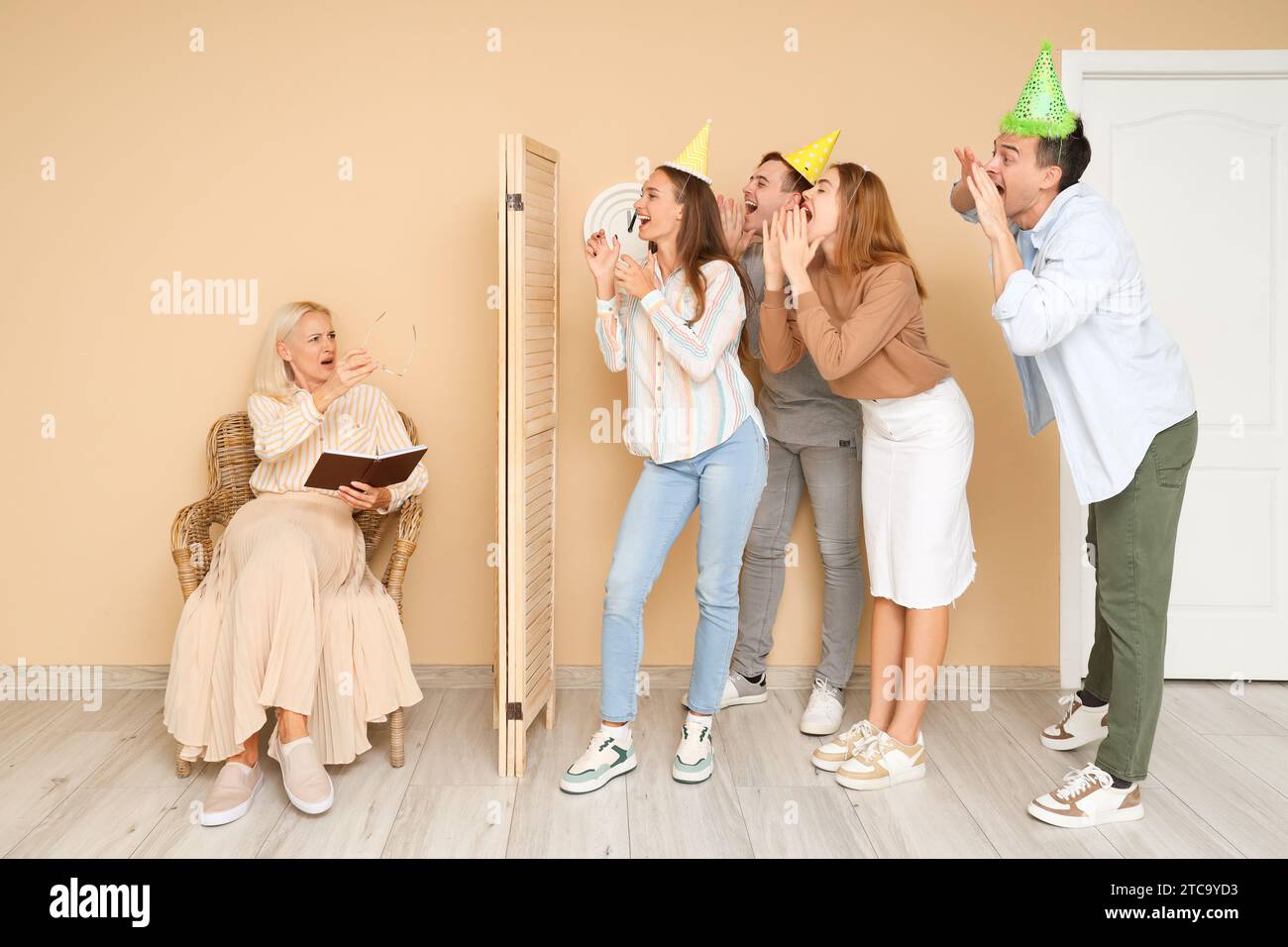 Mature woman suffering from loud neighbours partying at home Stock ...
