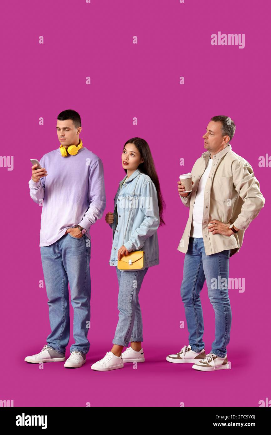 People waiting in line on purple background Stock Photo - Alamy