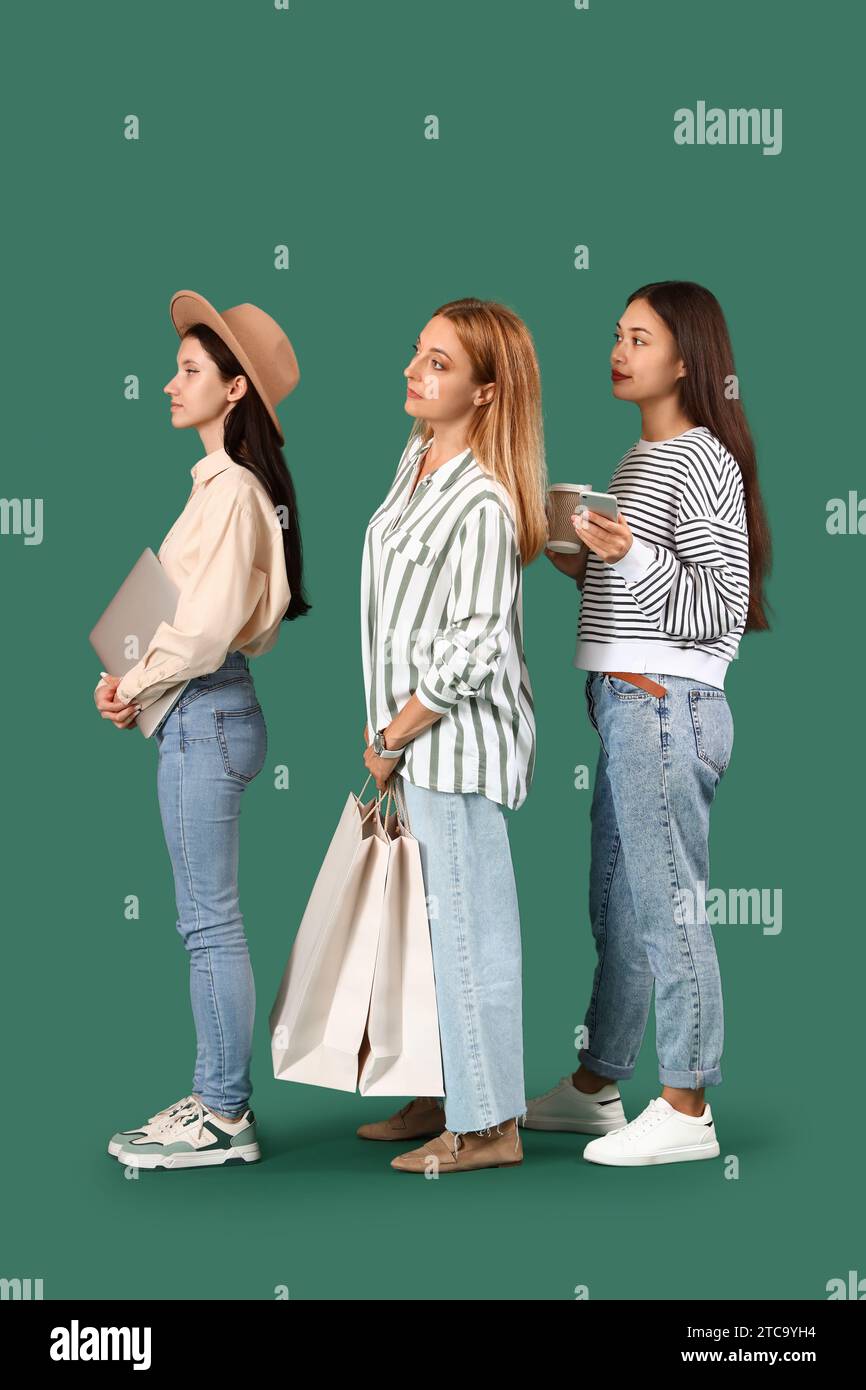 Women waiting in line on green background Stock Photo - Alamy