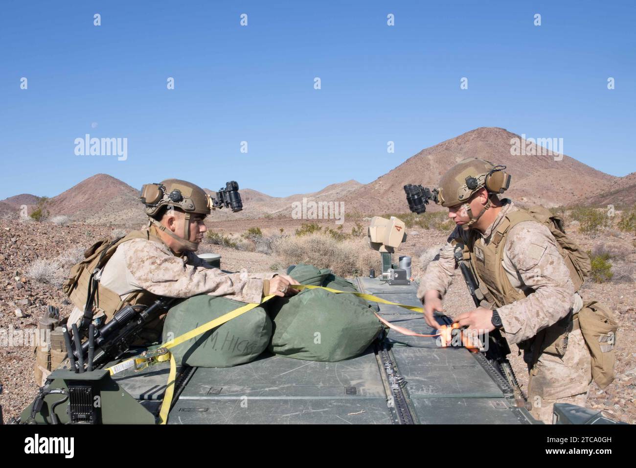 U.S. Marine Corps Lance Cpl. Hampton Green, left, a gunner, and Pfc. Austin Steele, a rocketeer ...