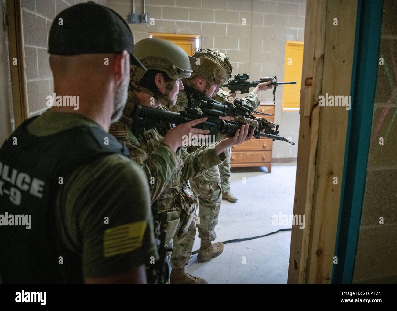 Airmen with the 115th Security Forces Squadron clear a Combined Arms ...
