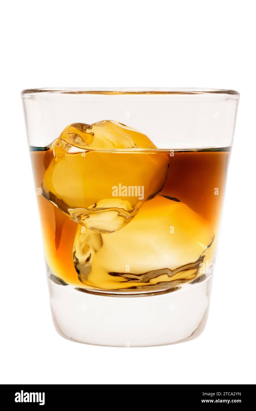 Whiskey on the rocks in an empty old fashioned glass on a white ...
