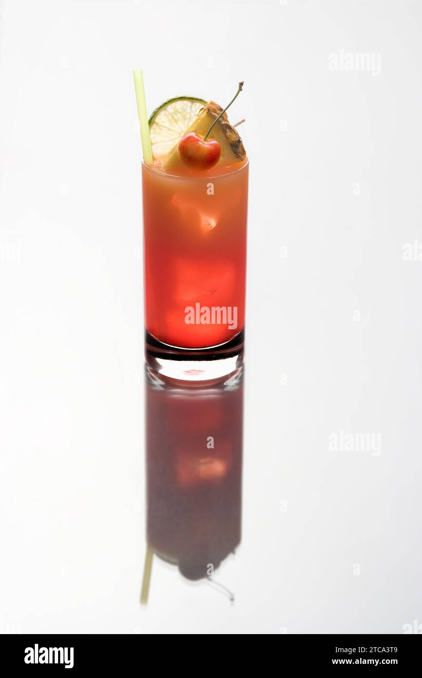 Mai Tai mixed drink with fruit garnish on a plain white background with ...
