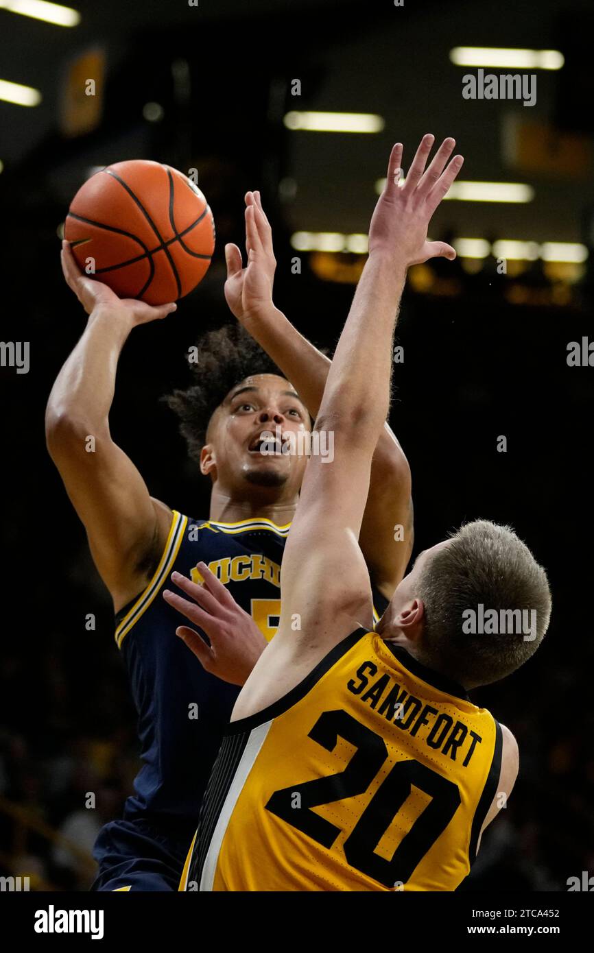 Michigan forward Terrance Williams II, left, shoots over Iowa forward ...