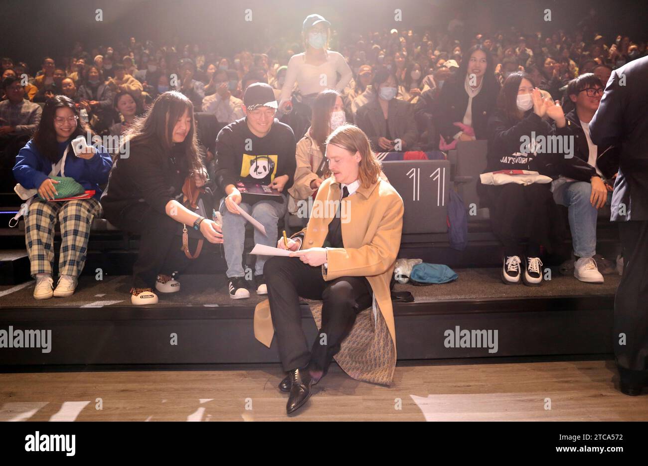 Caleb Landry Jones, American actor, signs his name for his fans at the ...