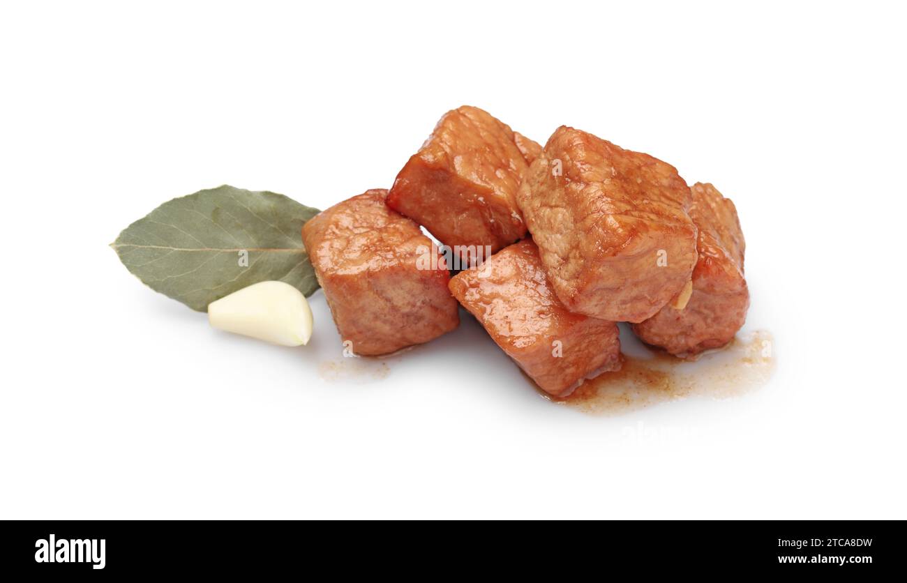 Pieces of delicious cooked beef, garlic and bay leaf isolated on white ...