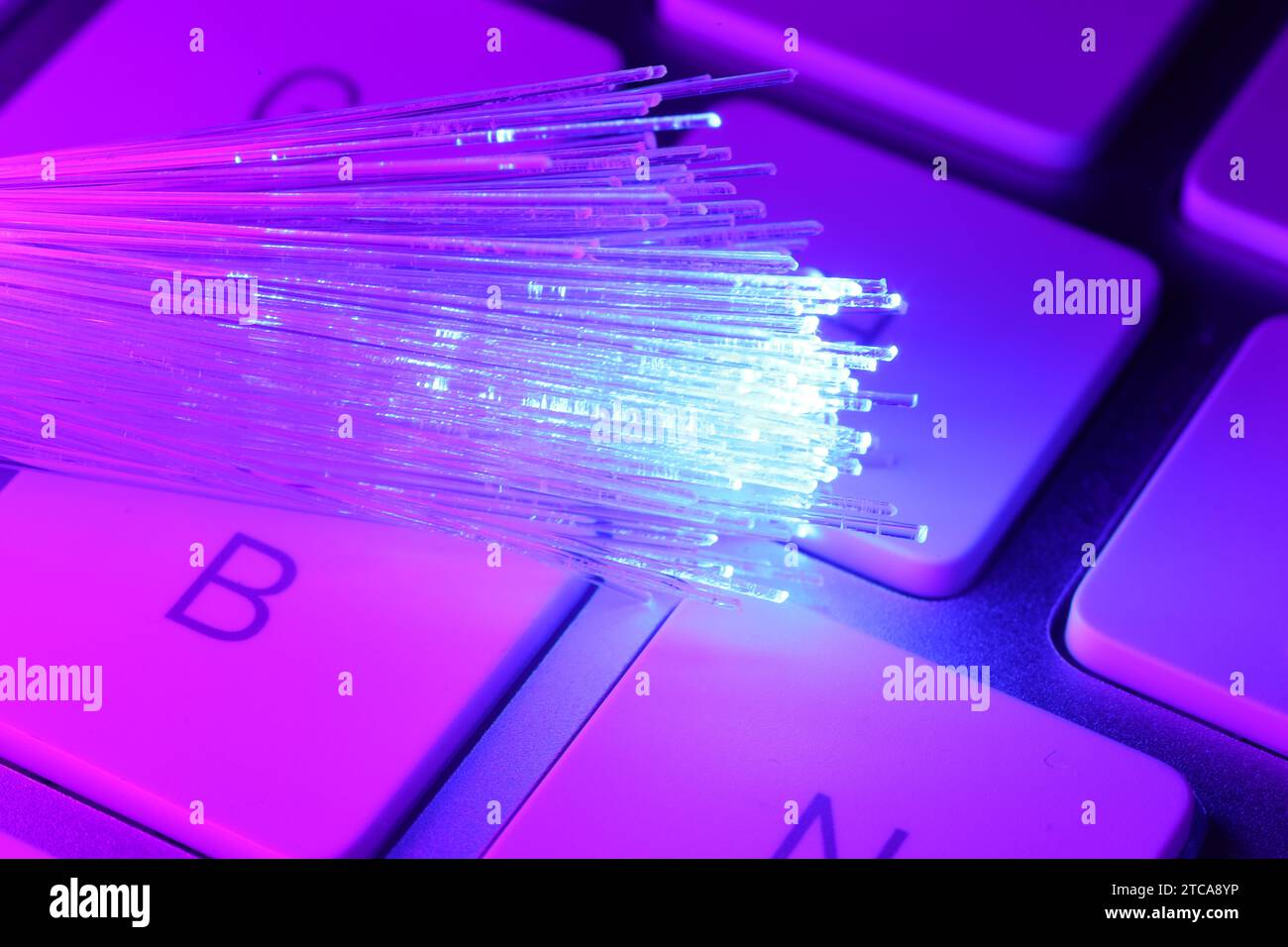 Optical fiber strands transmitting color light on computer keyboard ...