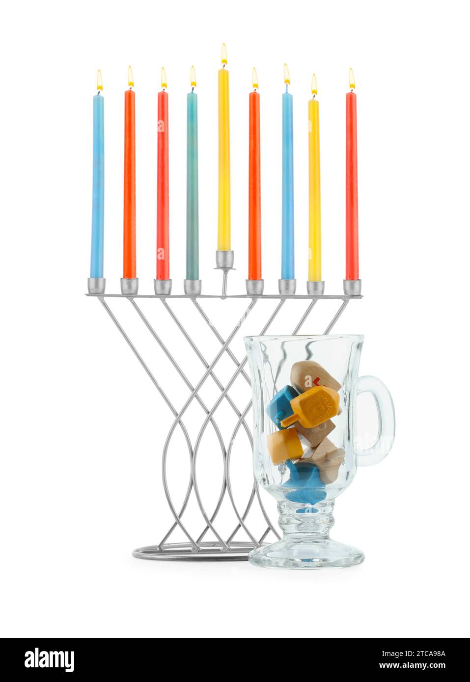 Hanukkah celebration. Menorah with colorful candles and dreidels in ...